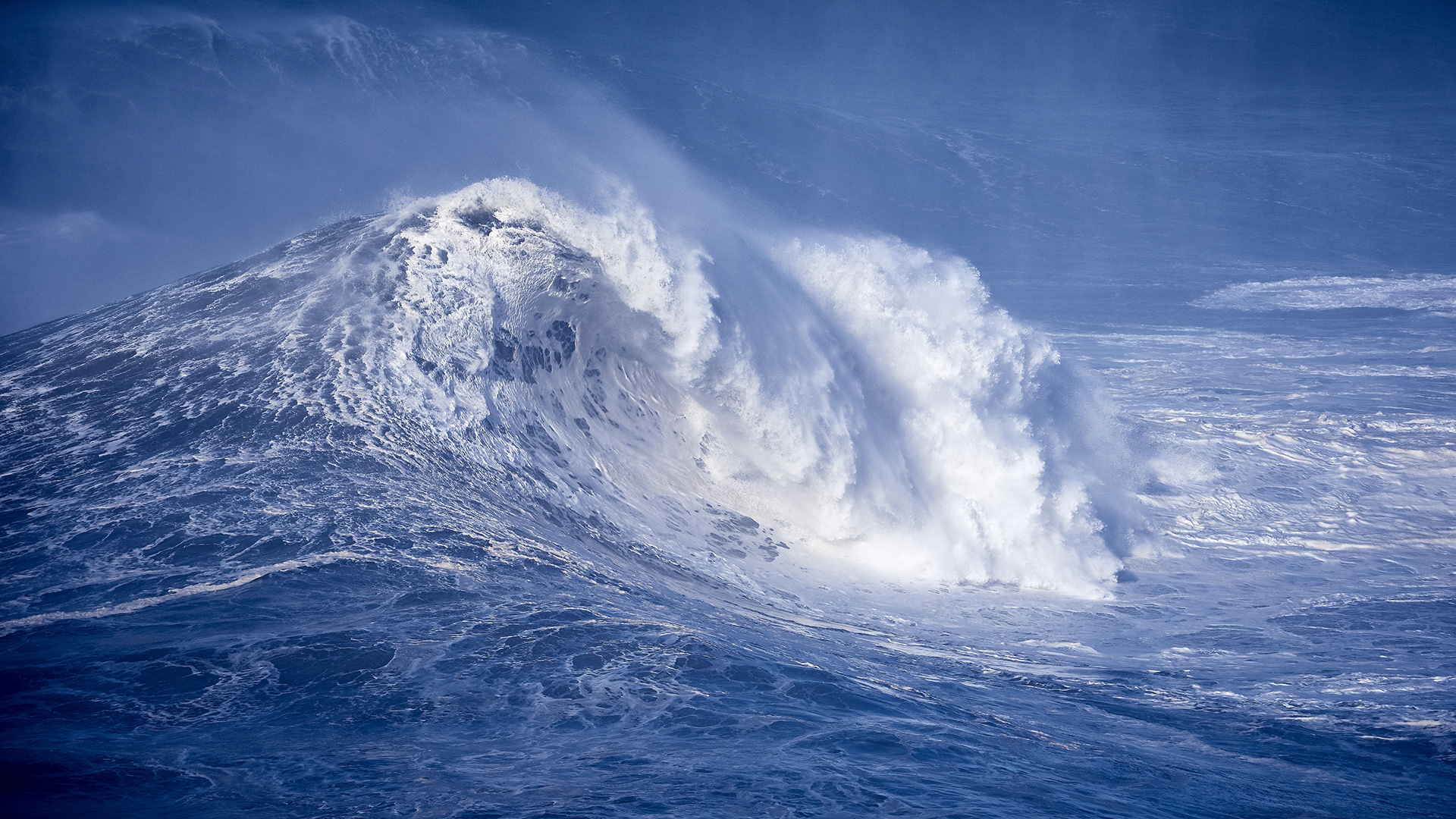 Jürg Kaufmann Captures the Beauty of the Monstrous Nazaré Waves